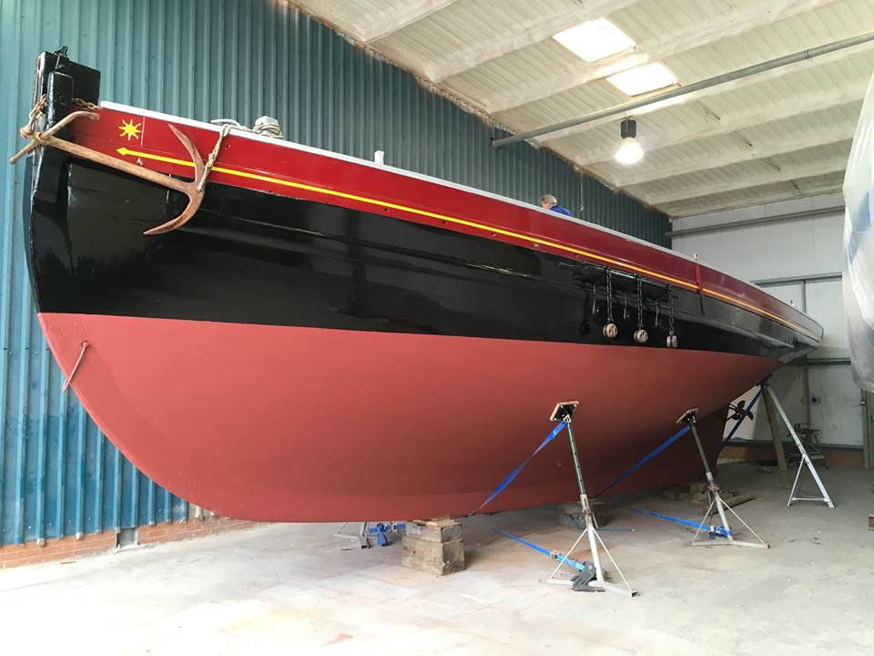 Classic 1881 Sailing Smack lifted ashore